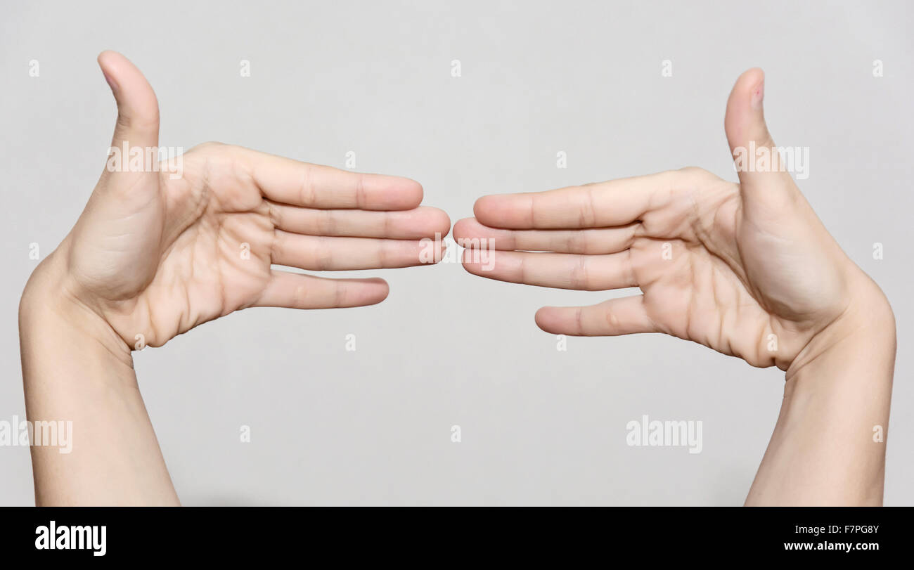Female hands making funny shape. Body part Stock Photo - Alamy