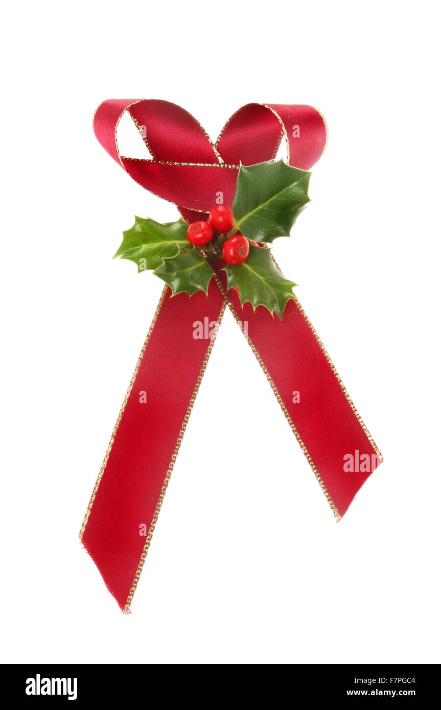 Christmas motif, gold edged red ribbon bow with a sprig of Holly ...