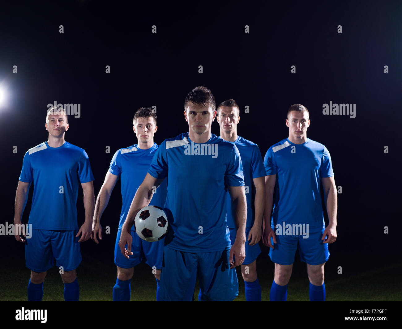 soccer players team group isolated on black background Stock Photo - Alamy