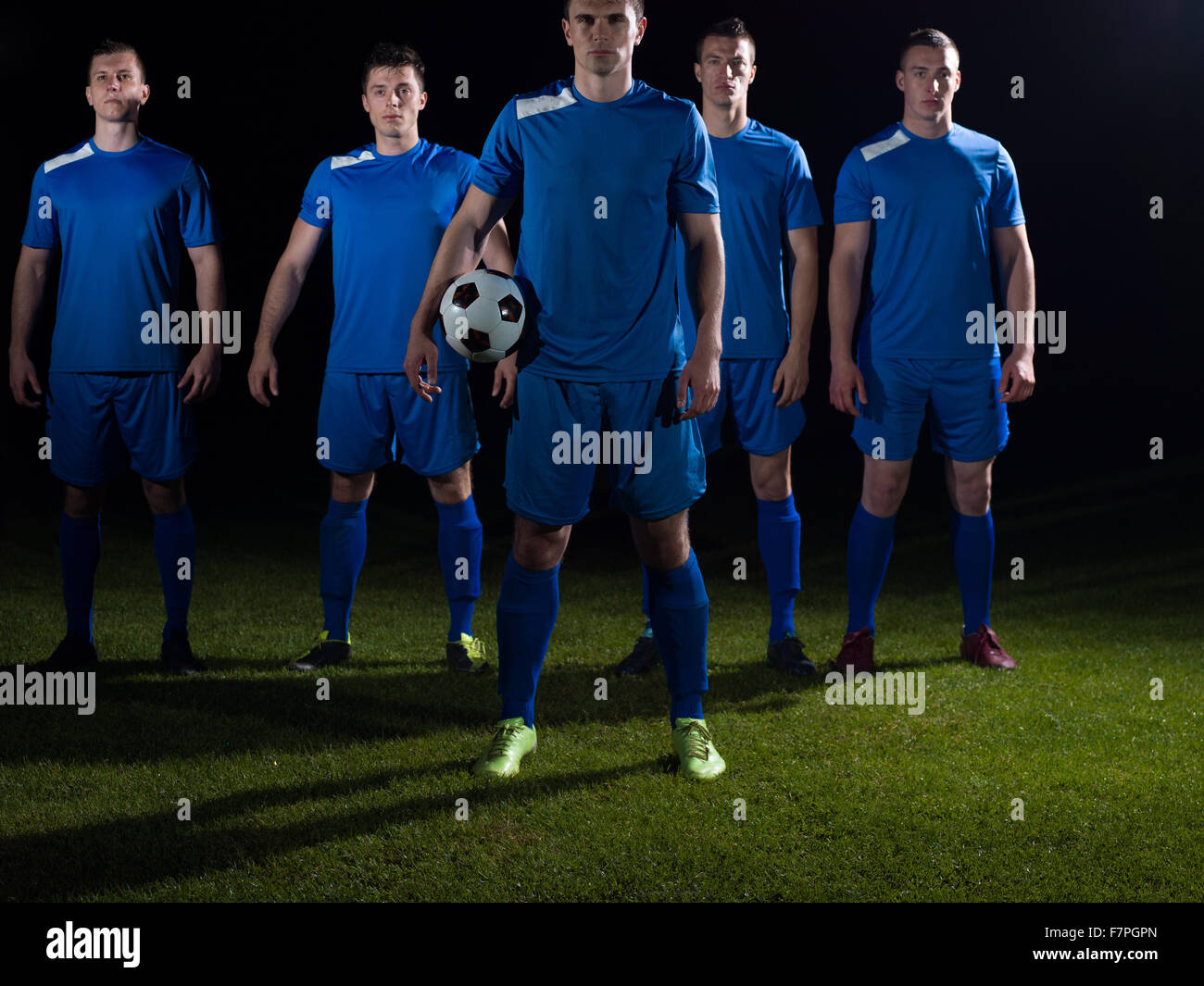 soccer players team group isolated on black background Stock Photo - Alamy