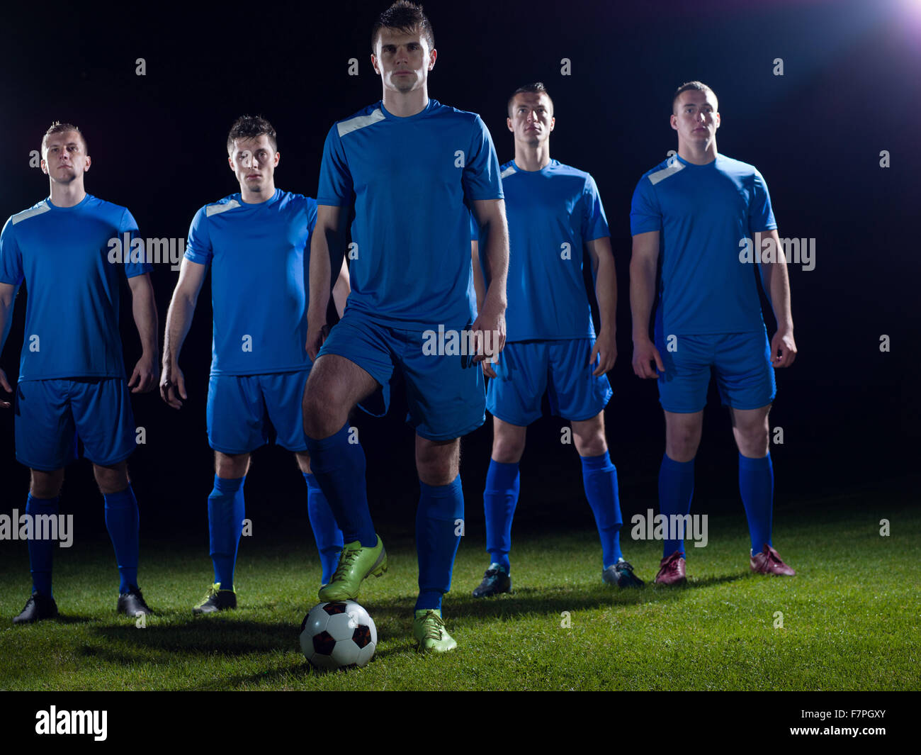 soccer players team group isolated on black background Stock Photo - Alamy
