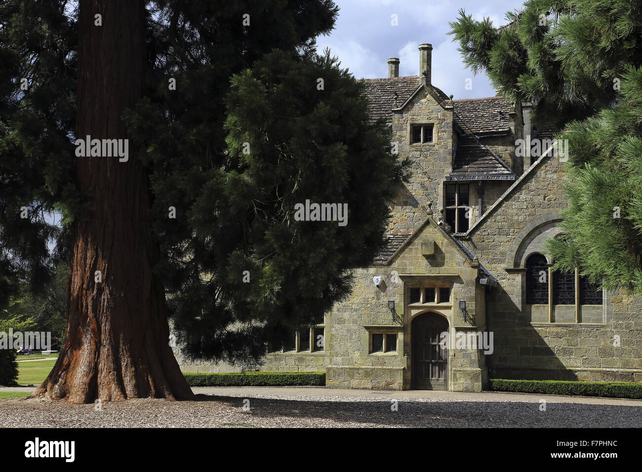 The house at Wakehurst Place, West Sussex, framed by trees Stock Photo ...