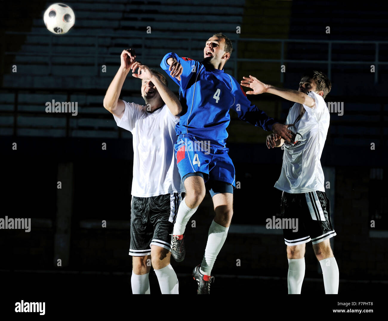 competition Action run and jump Duel of football players at soccer ball ...