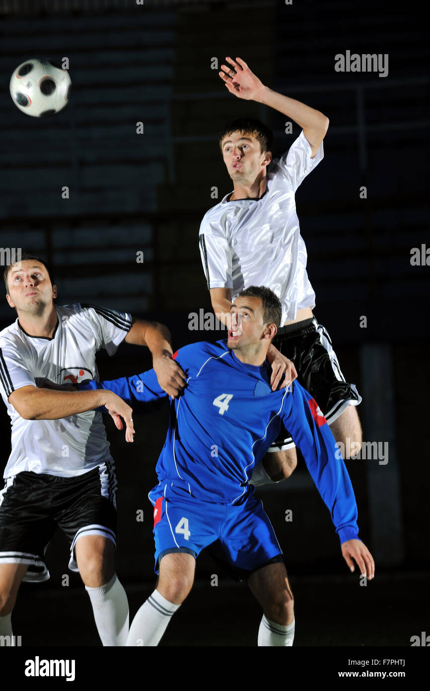 competition Action run and jump Duel of football players at soccer ball ...