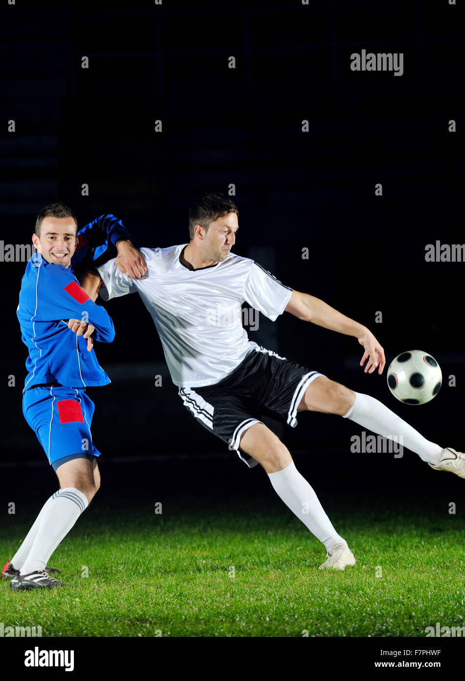 competition Action run and jump Duel of football players at soccer ball ...