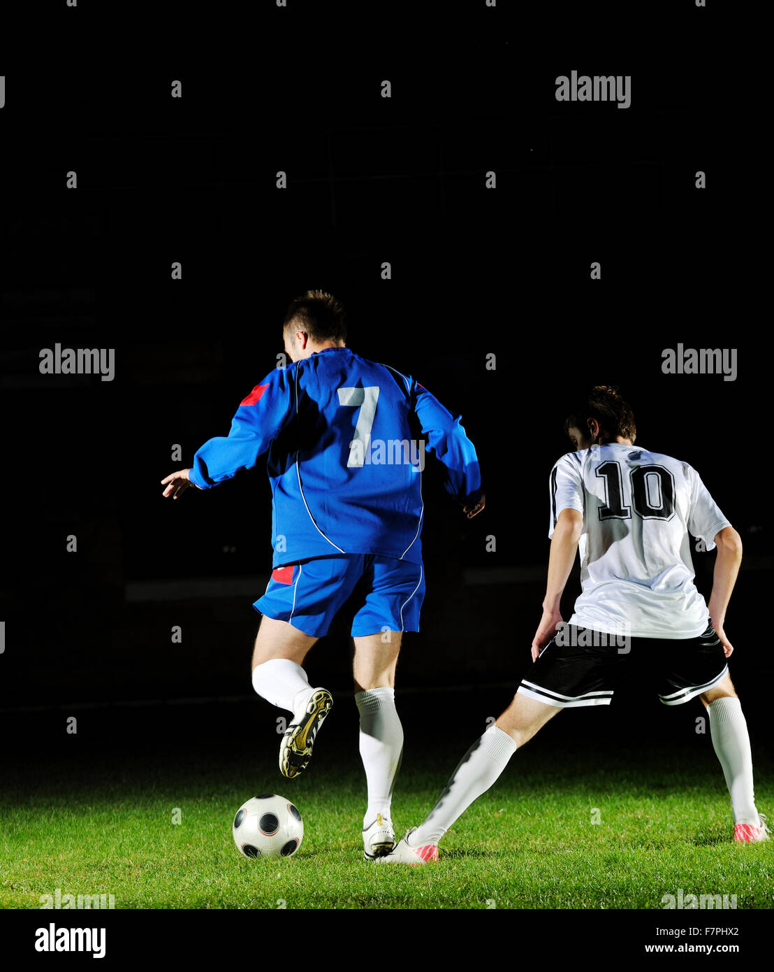 competition Action run and jump Duel of football players at soccer ball ...