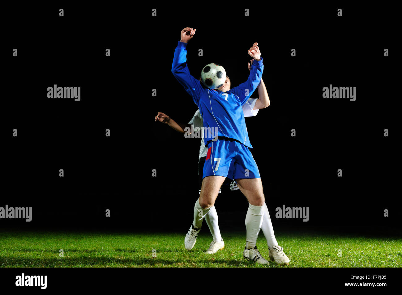 competition Action run and jump Duel of football players at soccer ball ...