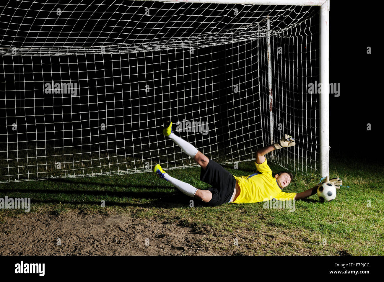 goalkeeper soccer player people on football stadium grass field Stock ...