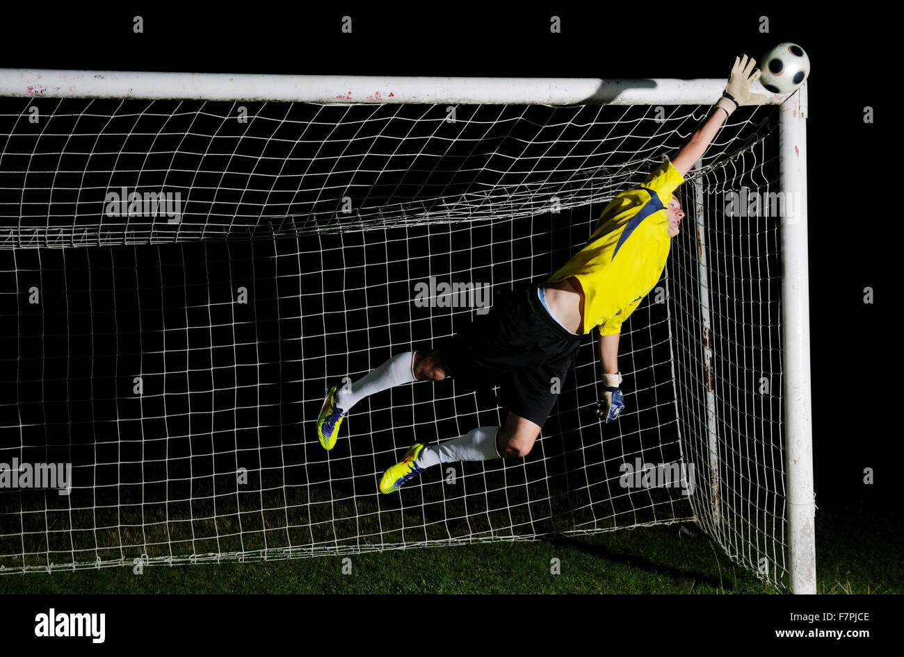 goalkeeper soccer player people on football stadium grass field Stock ...