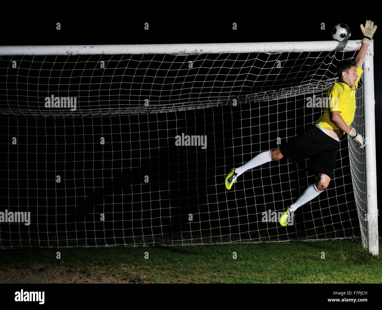 goalkeeper soccer player people on football stadium grass field Stock ...