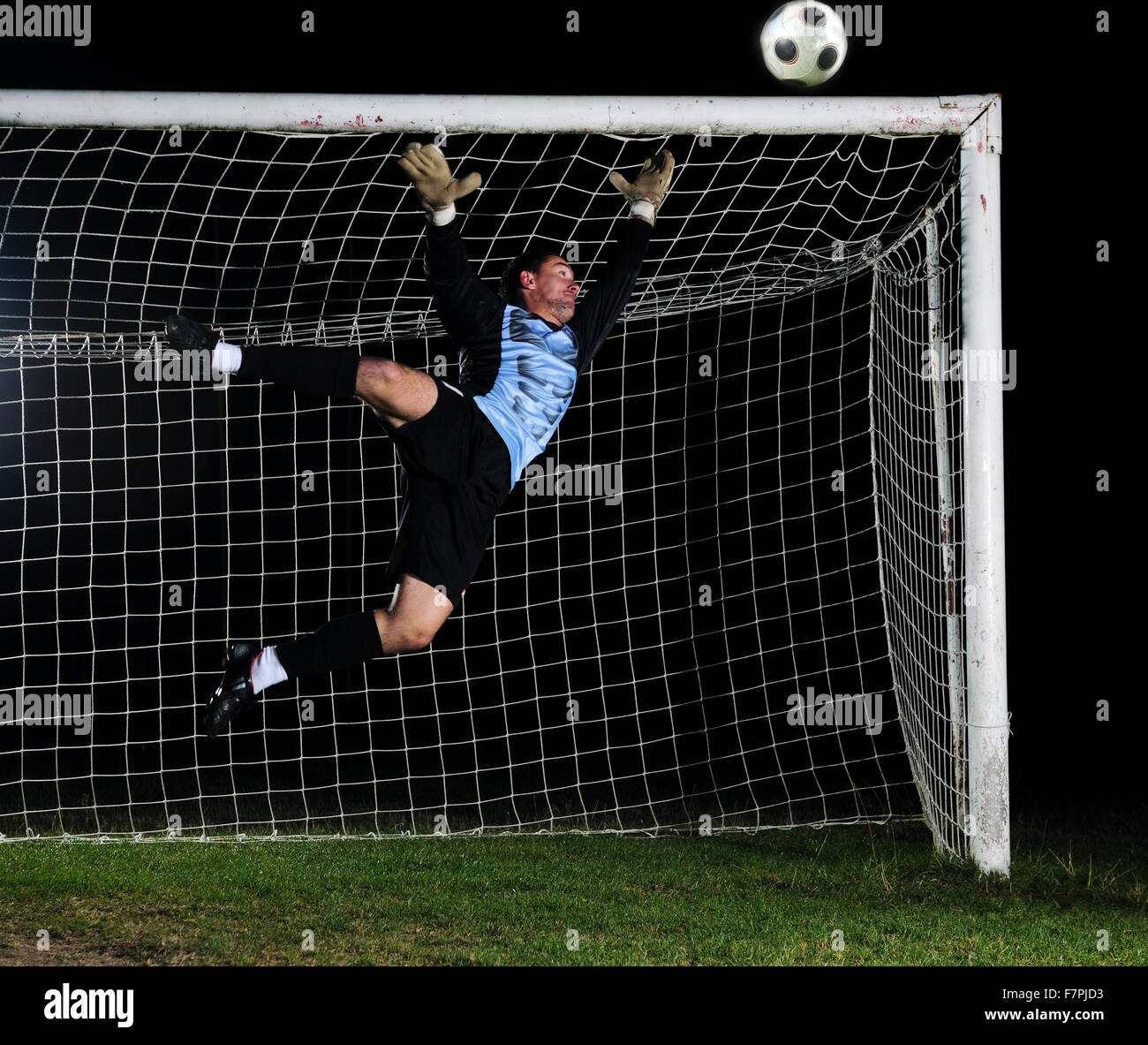 goalkeeper soccer player people on football stadium grass field Stock ...