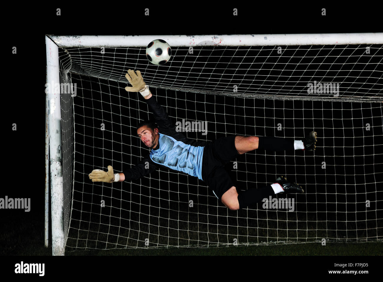 goalkeeper soccer player people on football stadium grass field Stock ...