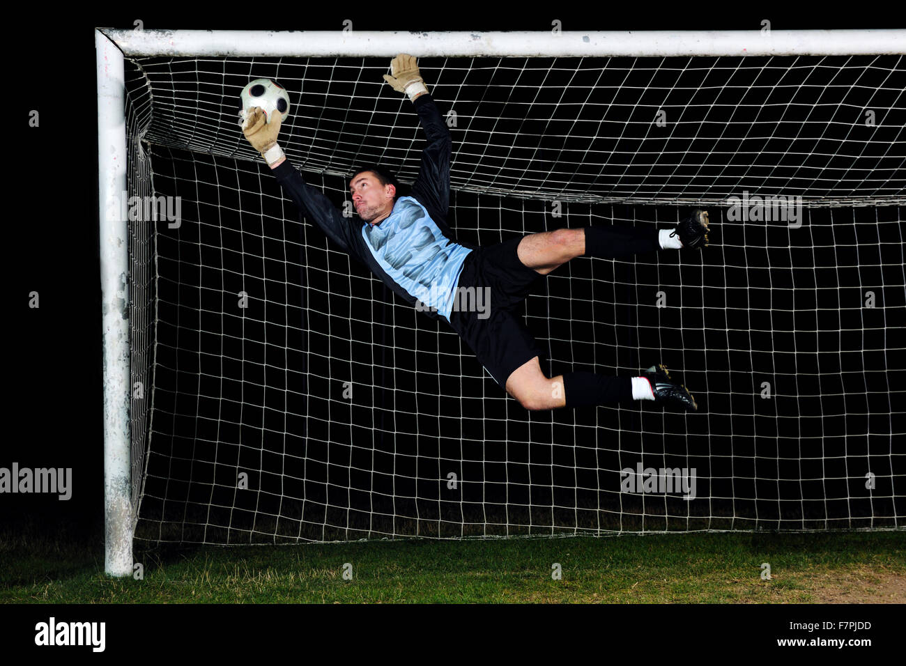 goalkeeper soccer player people on football stadium grass field Stock ...