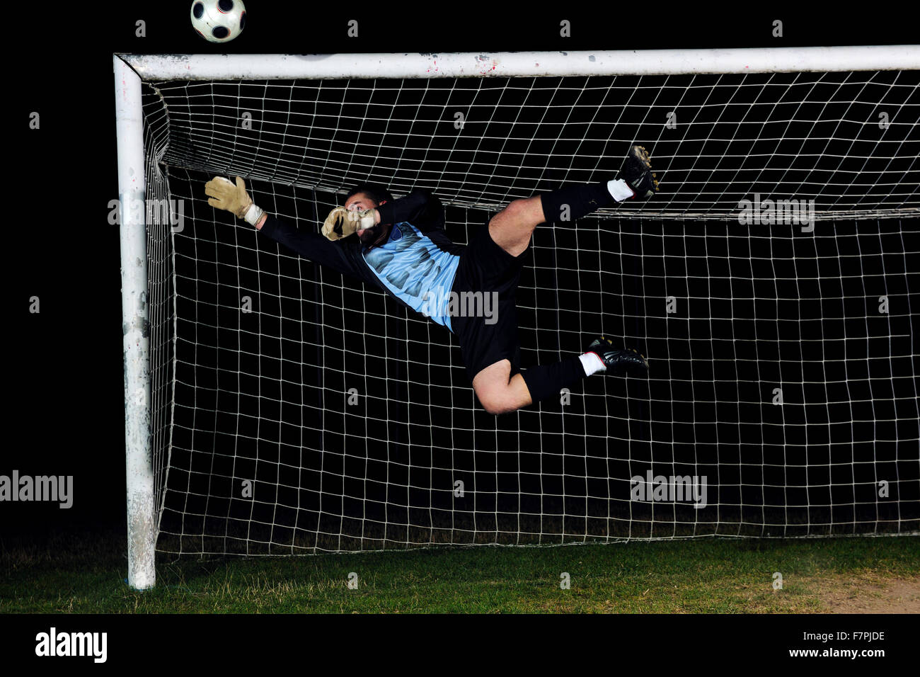goalkeeper soccer player people on football stadium grass field Stock ...
