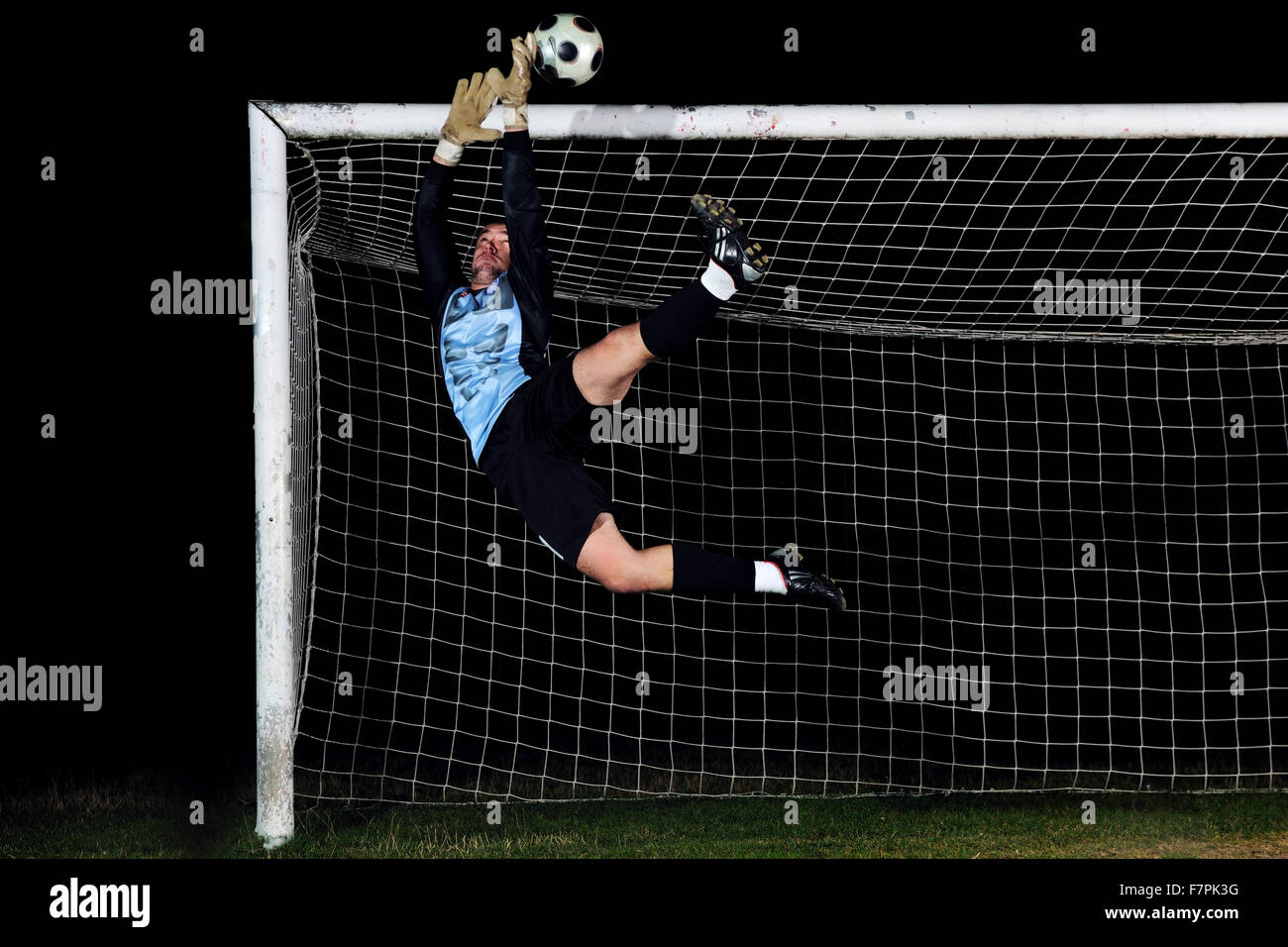 goalkeeper soccer player people on football stadium grass field Stock ...