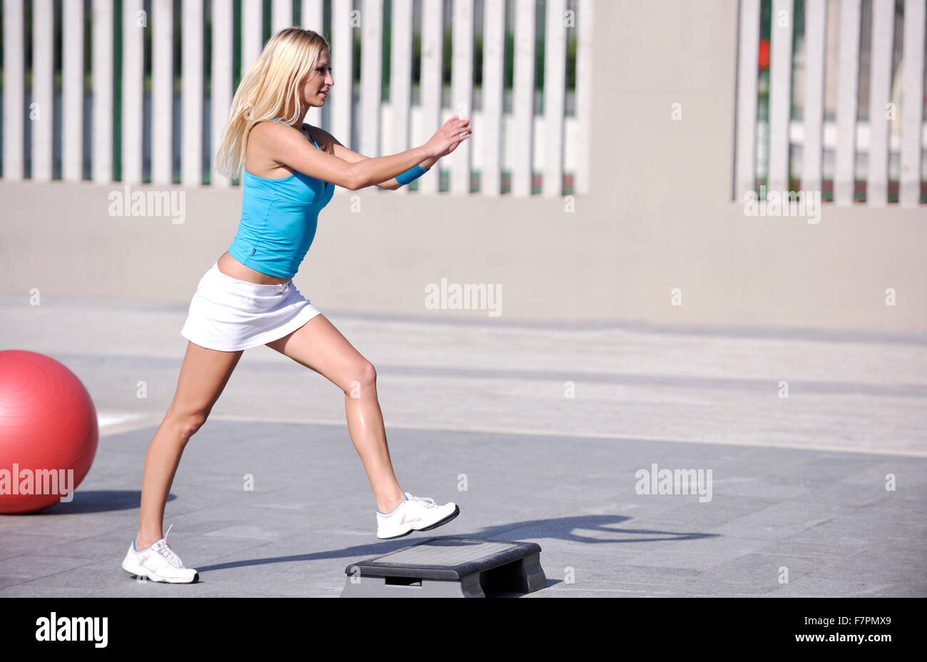 young beautiful healthy woman exercise fitness and stepping at swimming ...