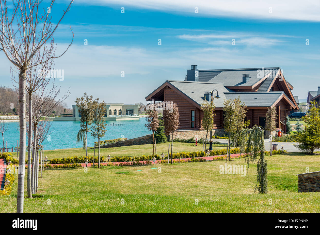 Modern house near water on bright day Stock Photo - Alamy