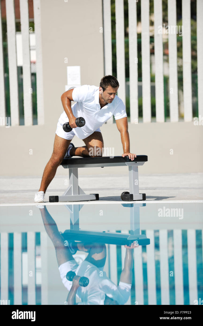 young healthy athlete man exercise at poolside Stock Photo - Alamy