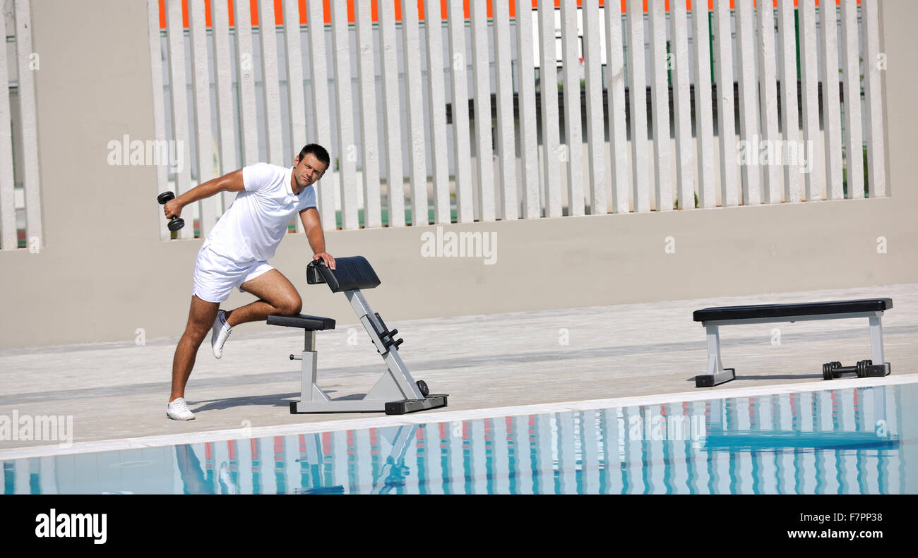 young healthy athlete man exercise at poolside Stock Photo - Alamy
