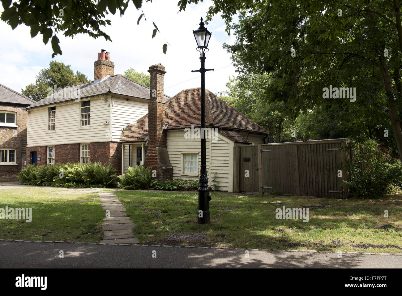 Mill Cottage, Morden Hall Park, London. To the left of the cottage is ...