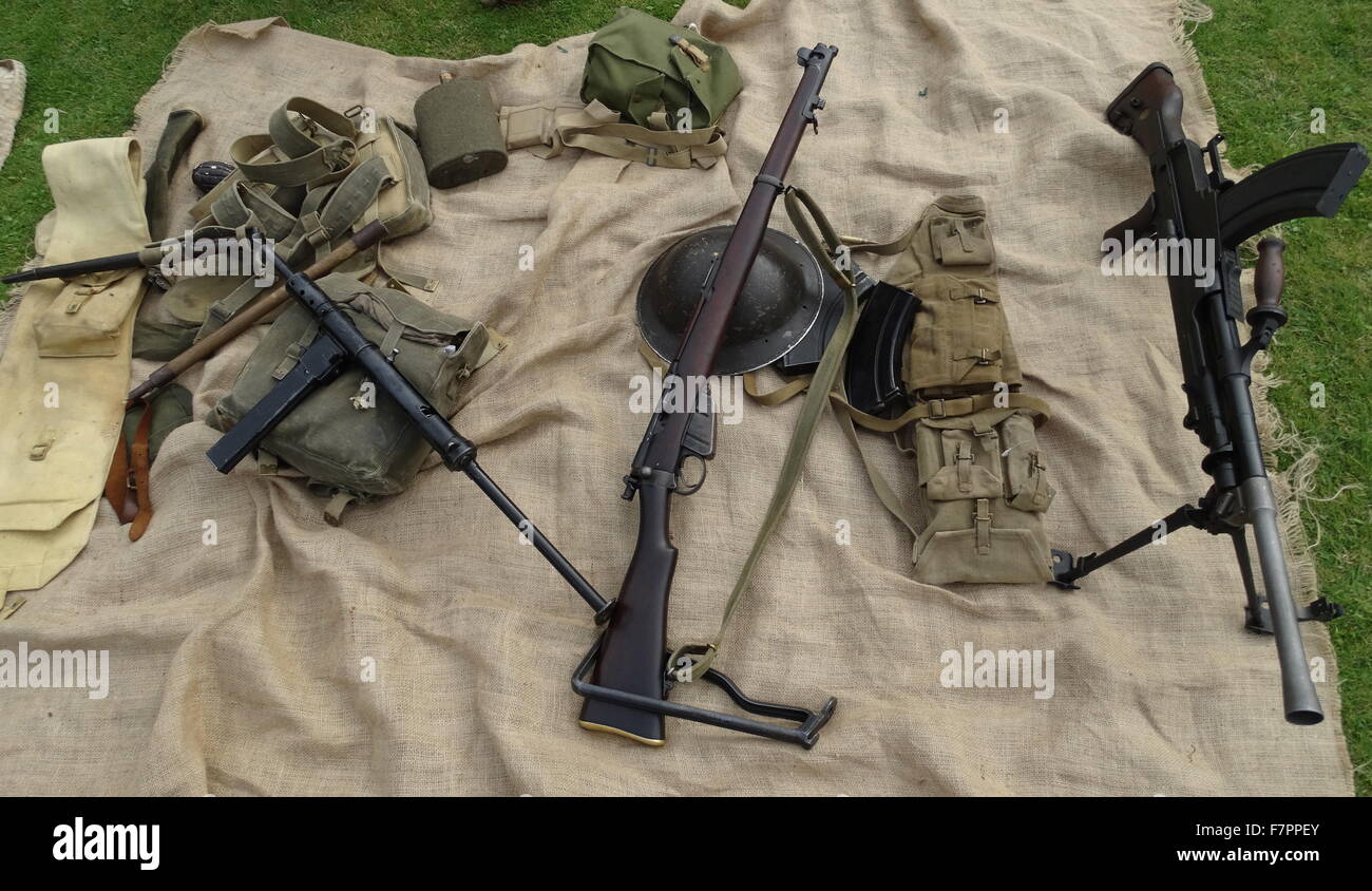 Helmets and guns of World War Two soliders. Dated 1942 Stock Photo - Alamy