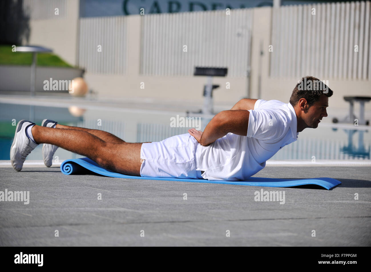 young healthy athlete man exercise at poolside Stock Photo - Alamy