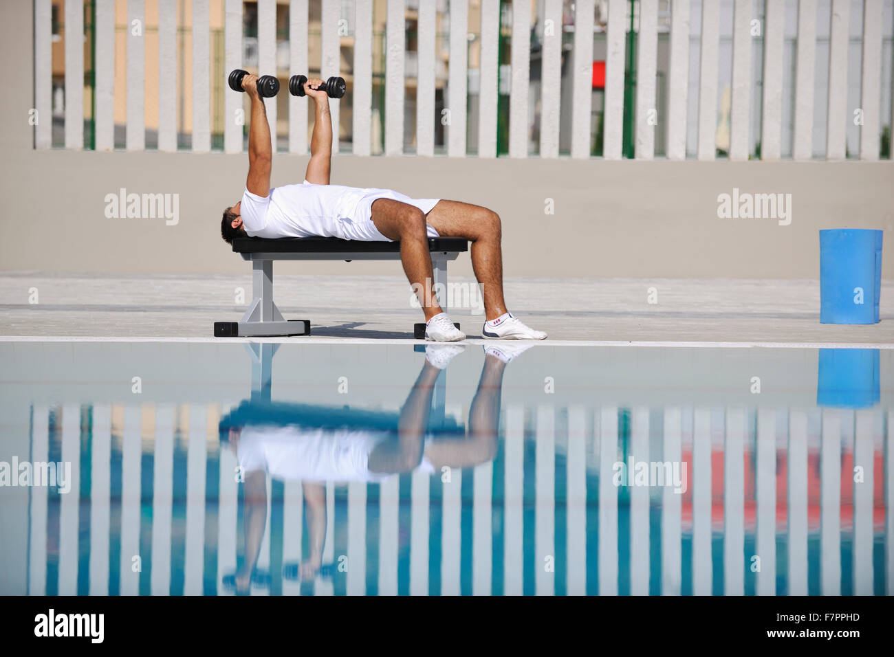 young healthy athlete man exercise at poolside Stock Photo - Alamy