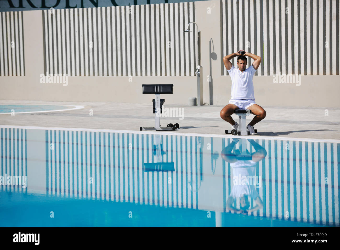 young healthy athlete man exercise at poolside Stock Photo - Alamy