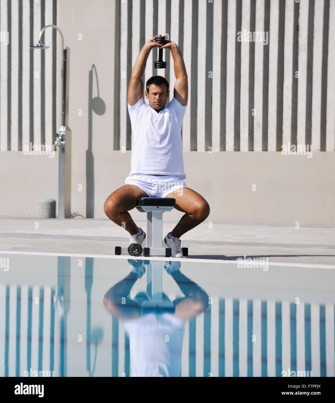 young healthy athlete man exercise at poolside Stock Photo - Alamy