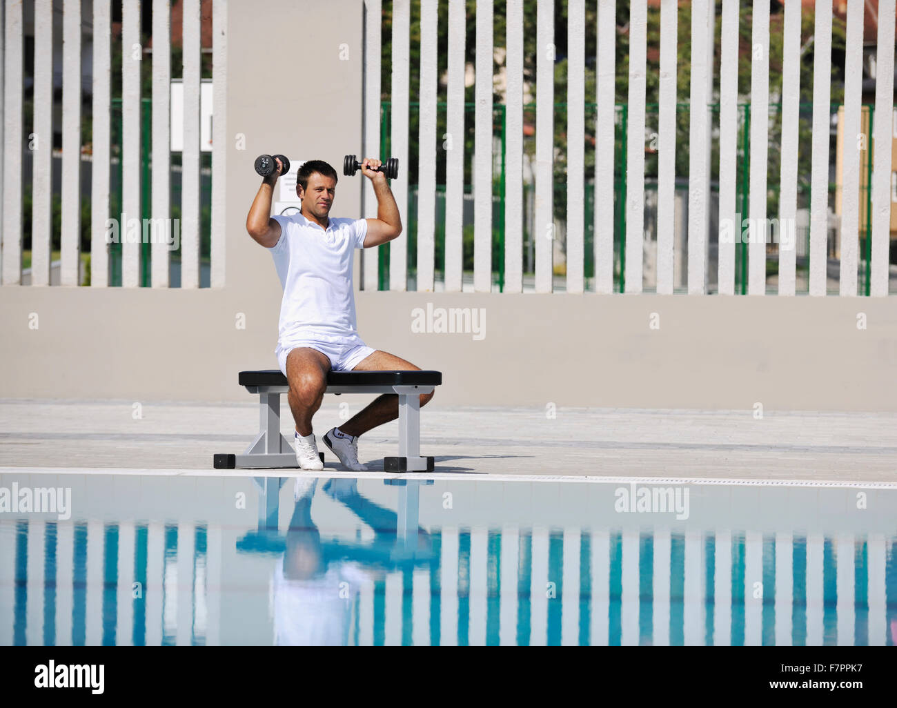young healthy athlete man exercise at poolside Stock Photo - Alamy