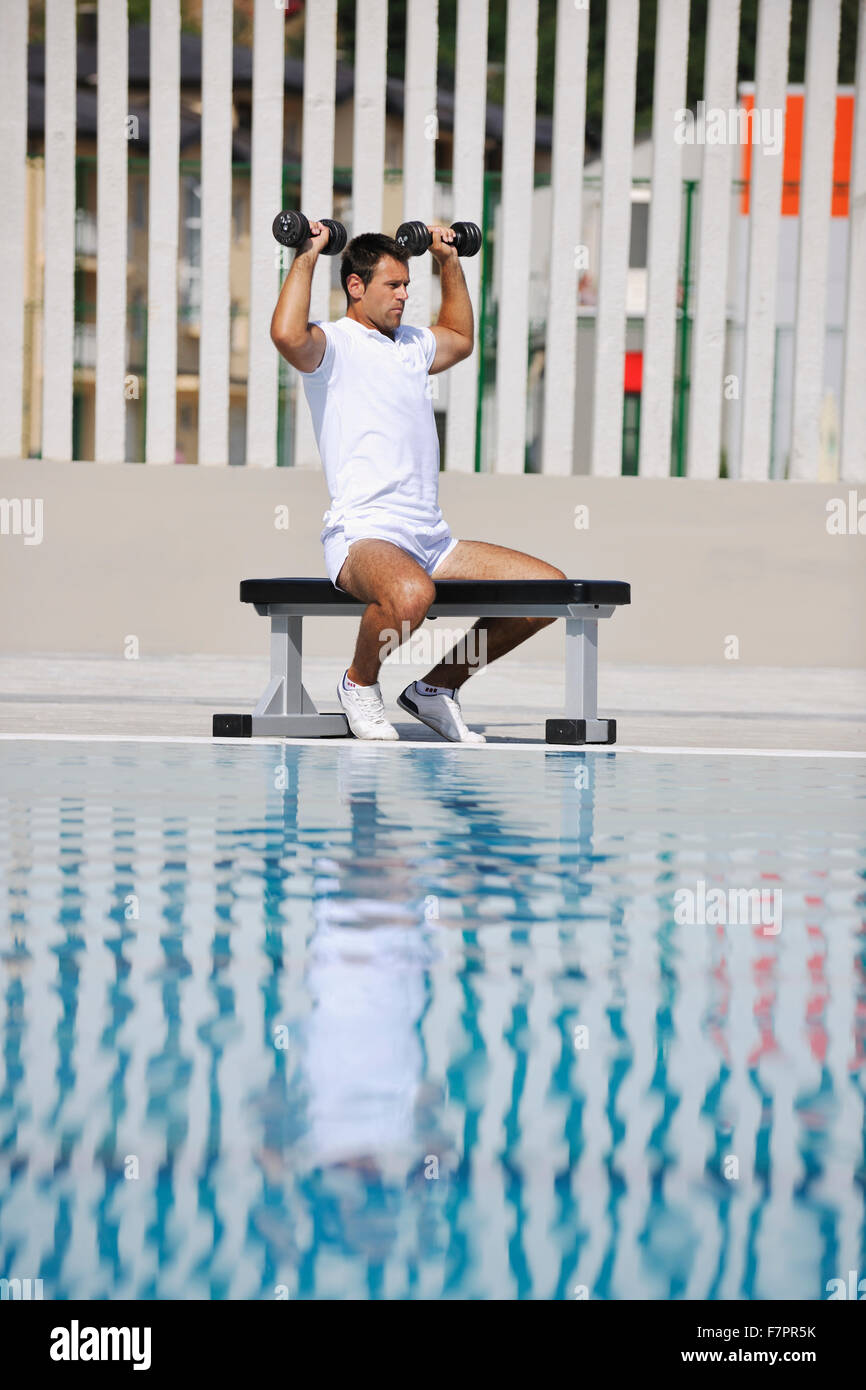young healthy athlete man exercise at poolside Stock Photo - Alamy