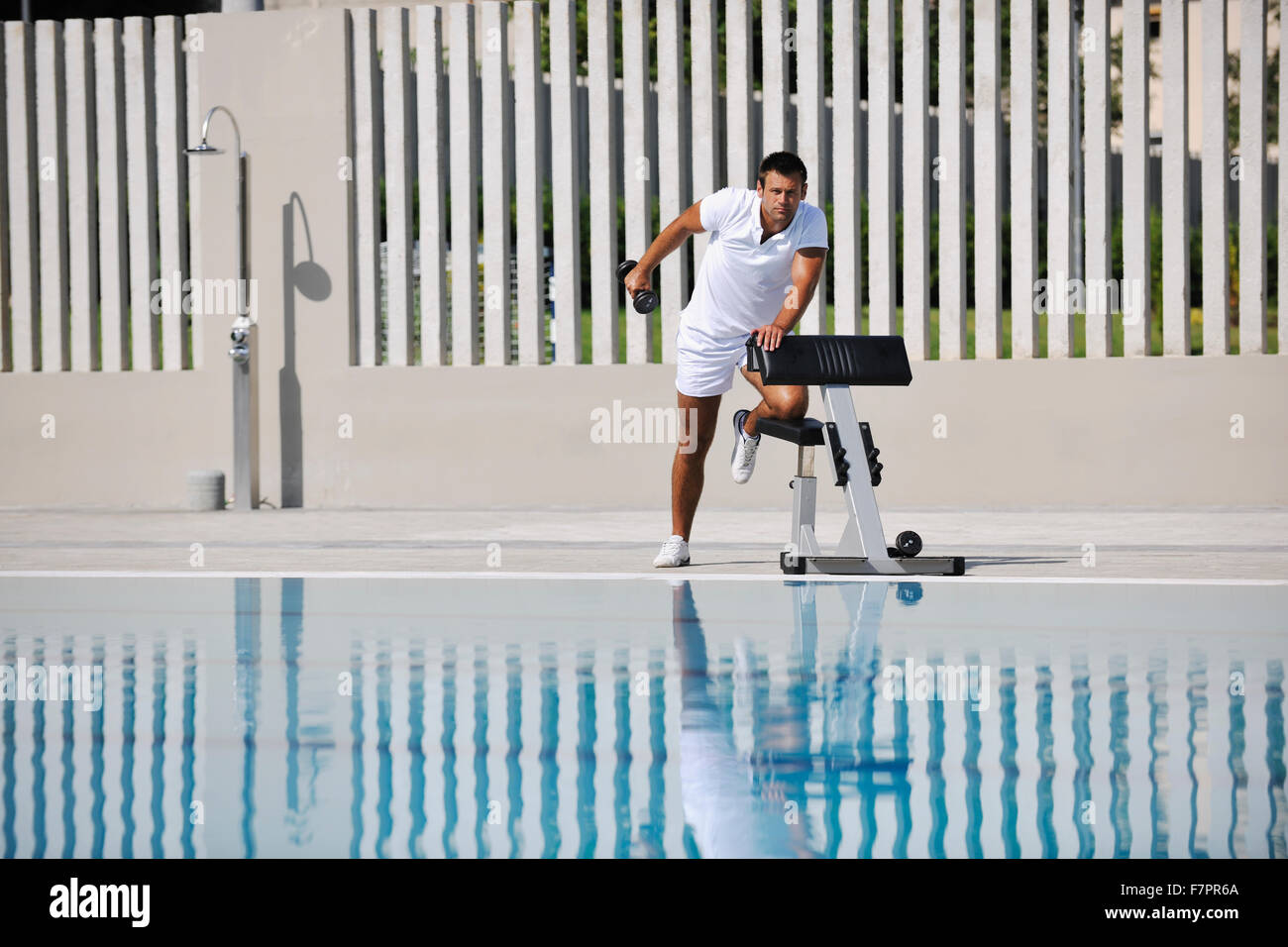 young healthy athlete man exercise at poolside Stock Photo - Alamy
