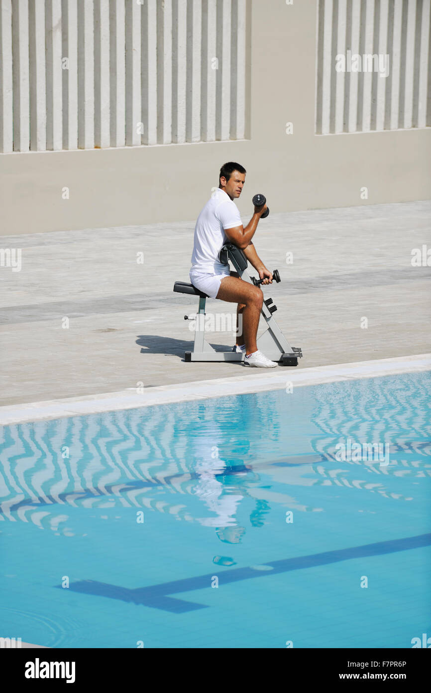 young healthy athlete man exercise at poolside Stock Photo - Alamy