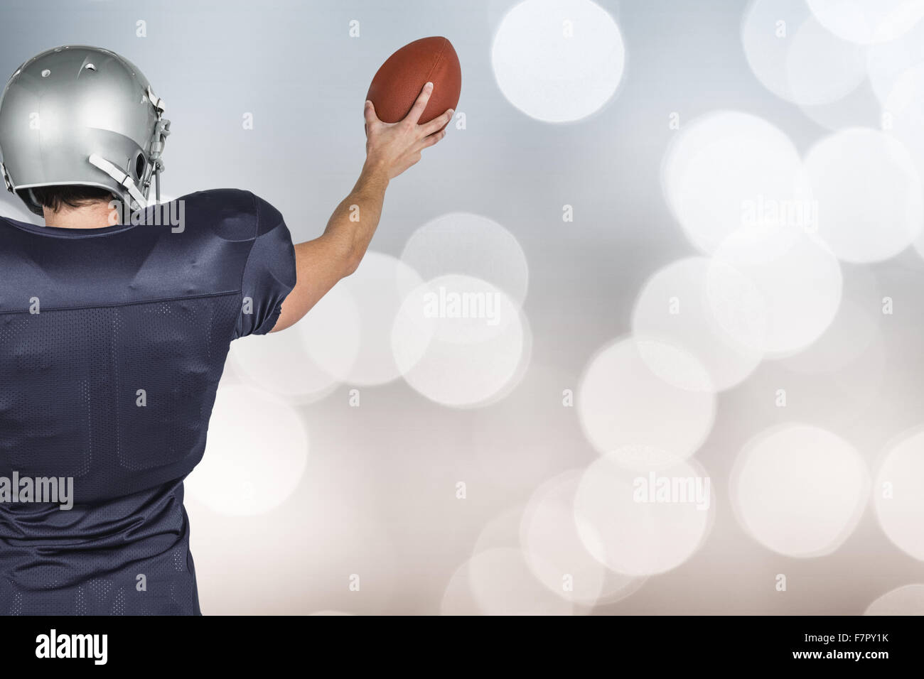Quarterback holding ball hi-res stock photography and images - Alamy