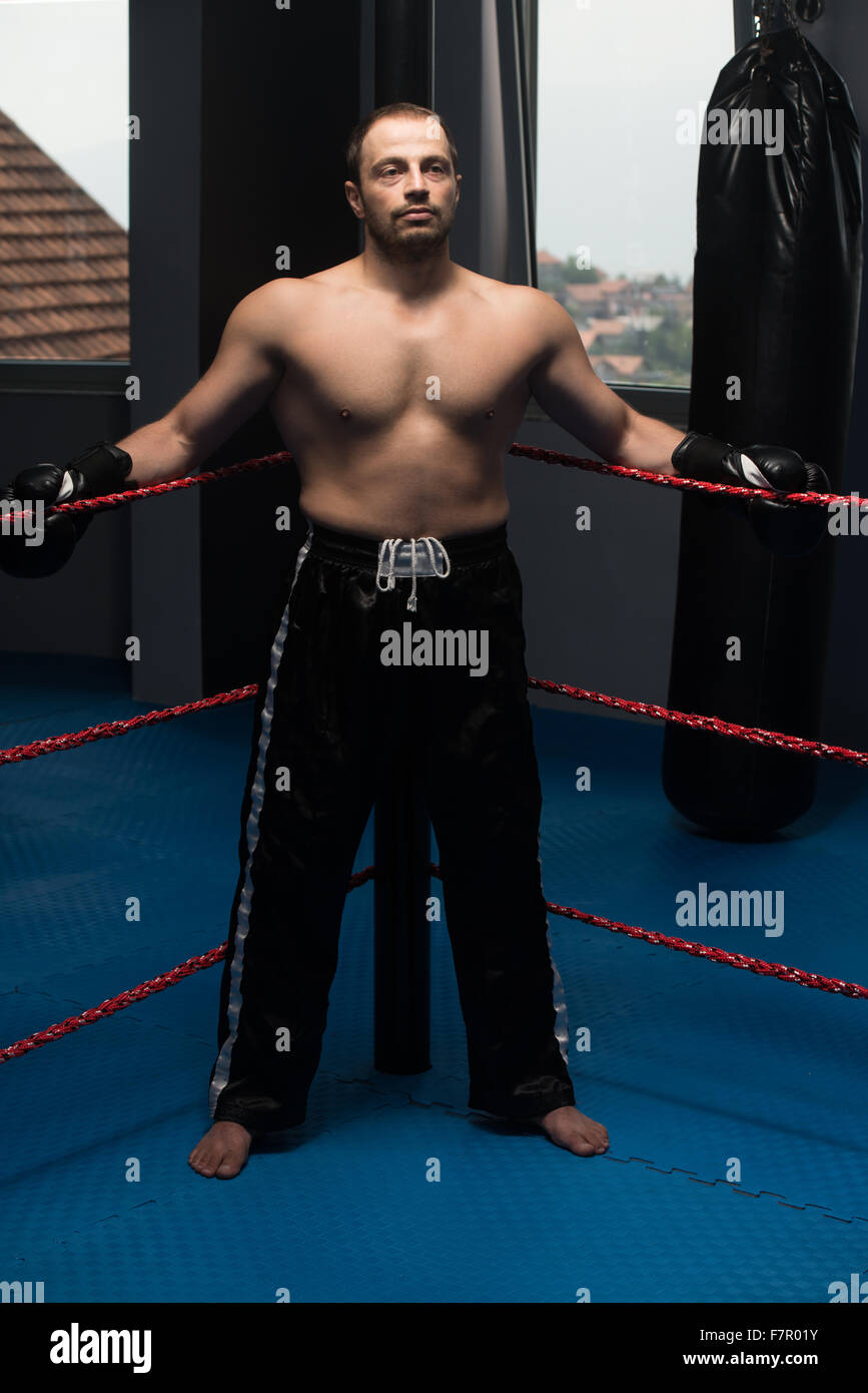 Boxer's Hand On The Ring Rope - Hi Is Relaxing Stock Photo - Alamy