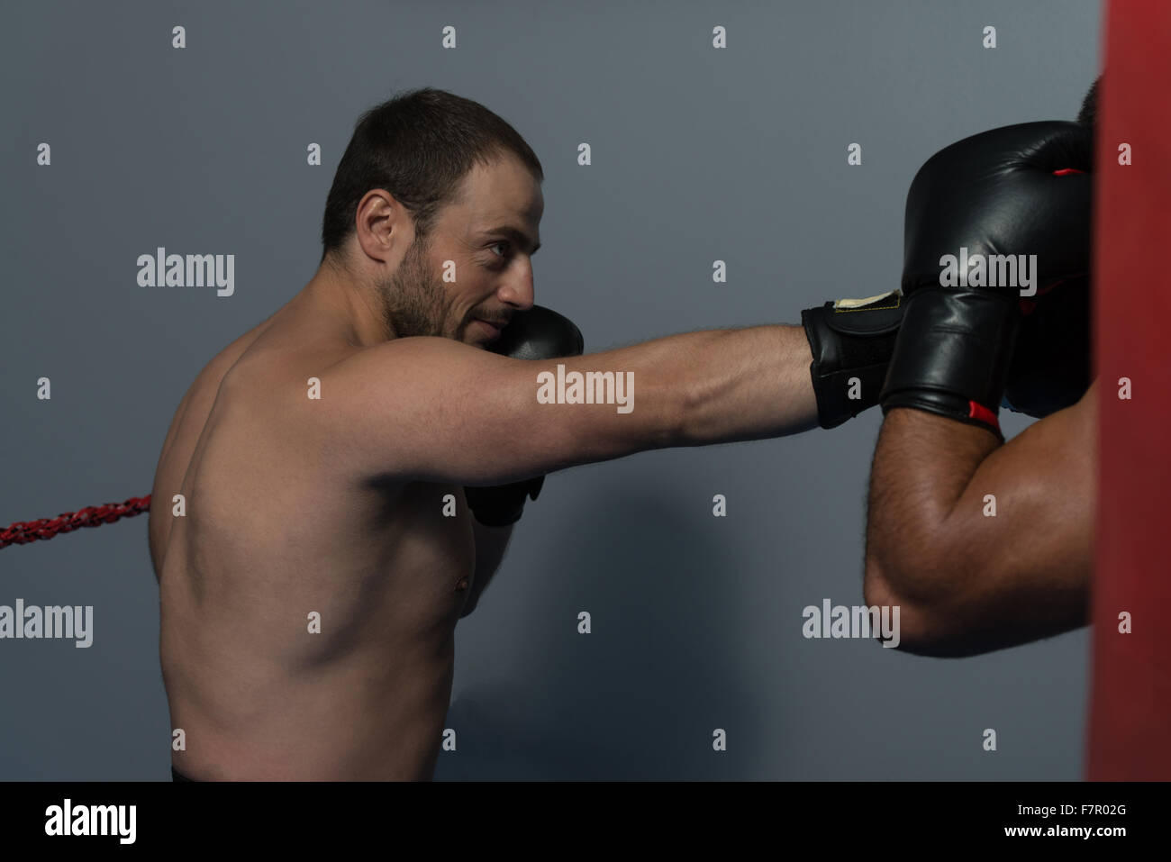 Strong Boxer And His Opponent During A Box Fight In A Ring Stock Photo ...