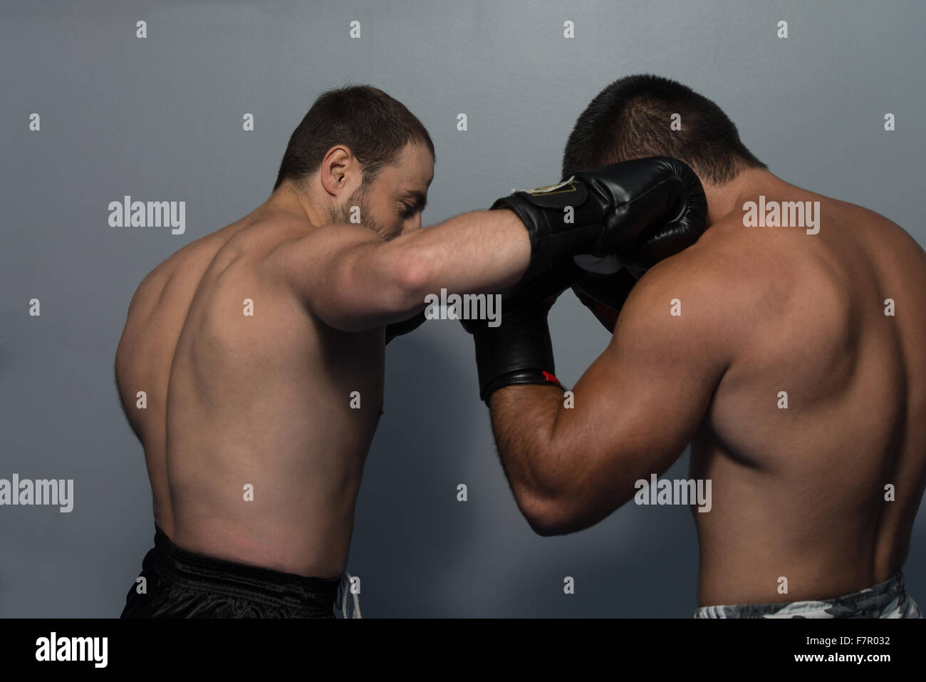 Strong Boxer And His Opponent During A Box Fight In A Ring Stock Photo ...