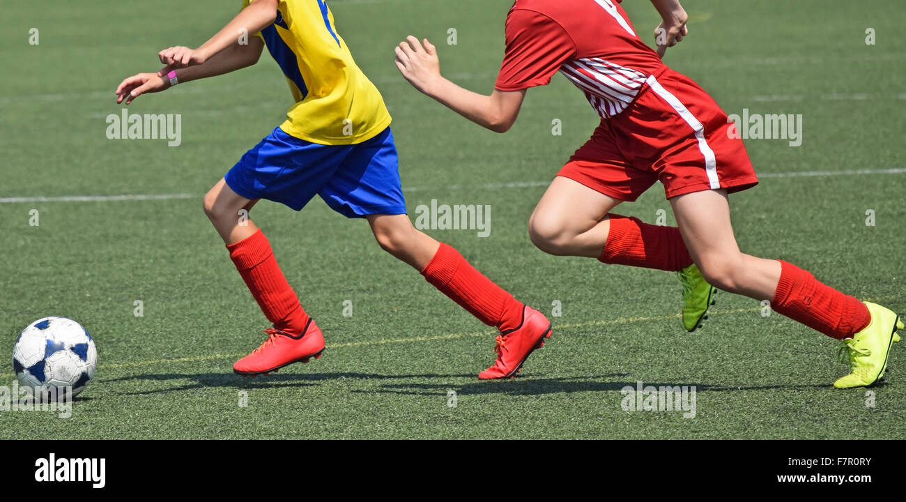 Young soccer players in action Stock Photo - Alamy