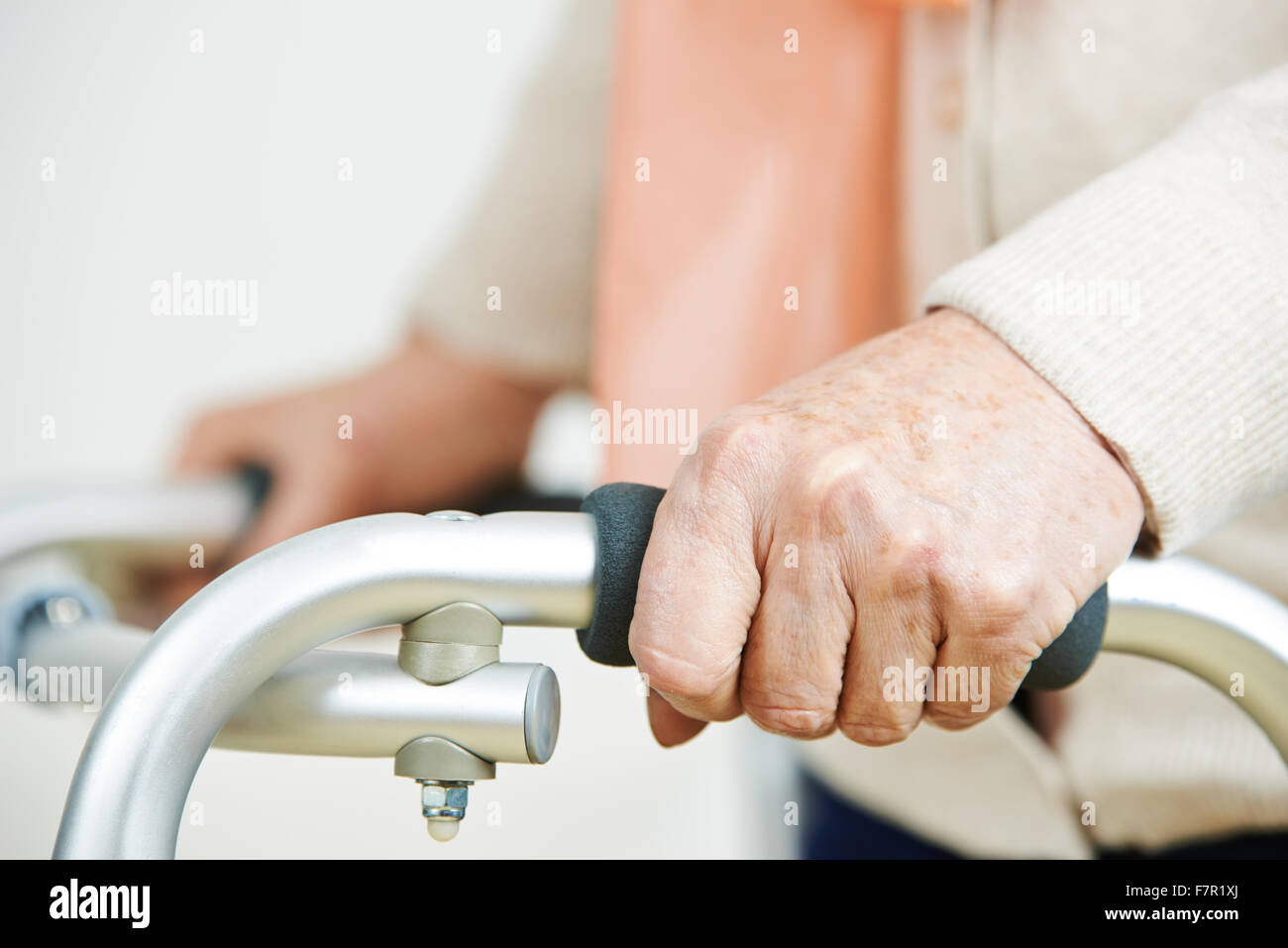 Hands of an old woman holding on to a walker Stock Photo - Alamy