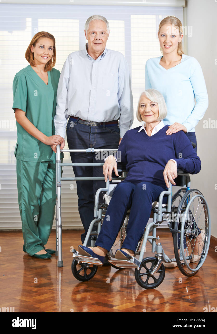 Geriatric caregiver with senior couple at home Stock Photo - Alamy
