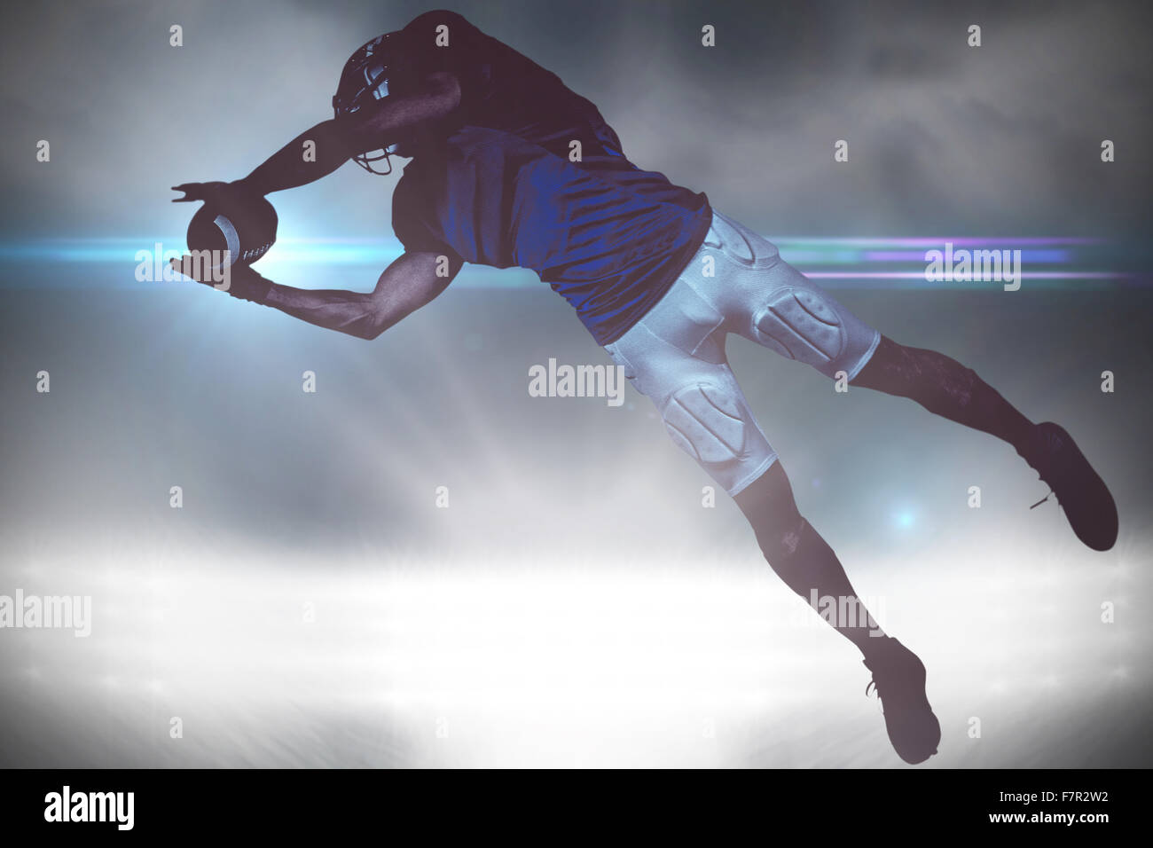 American football player catching ball hi-res stock photography and ...