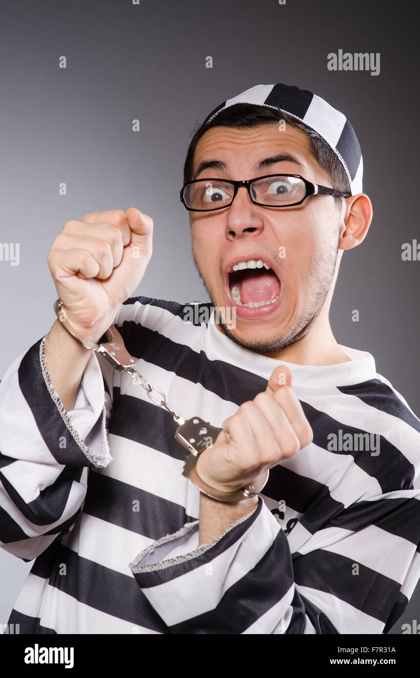 Funny prisoner isolated on gray Stock Photo - Alamy