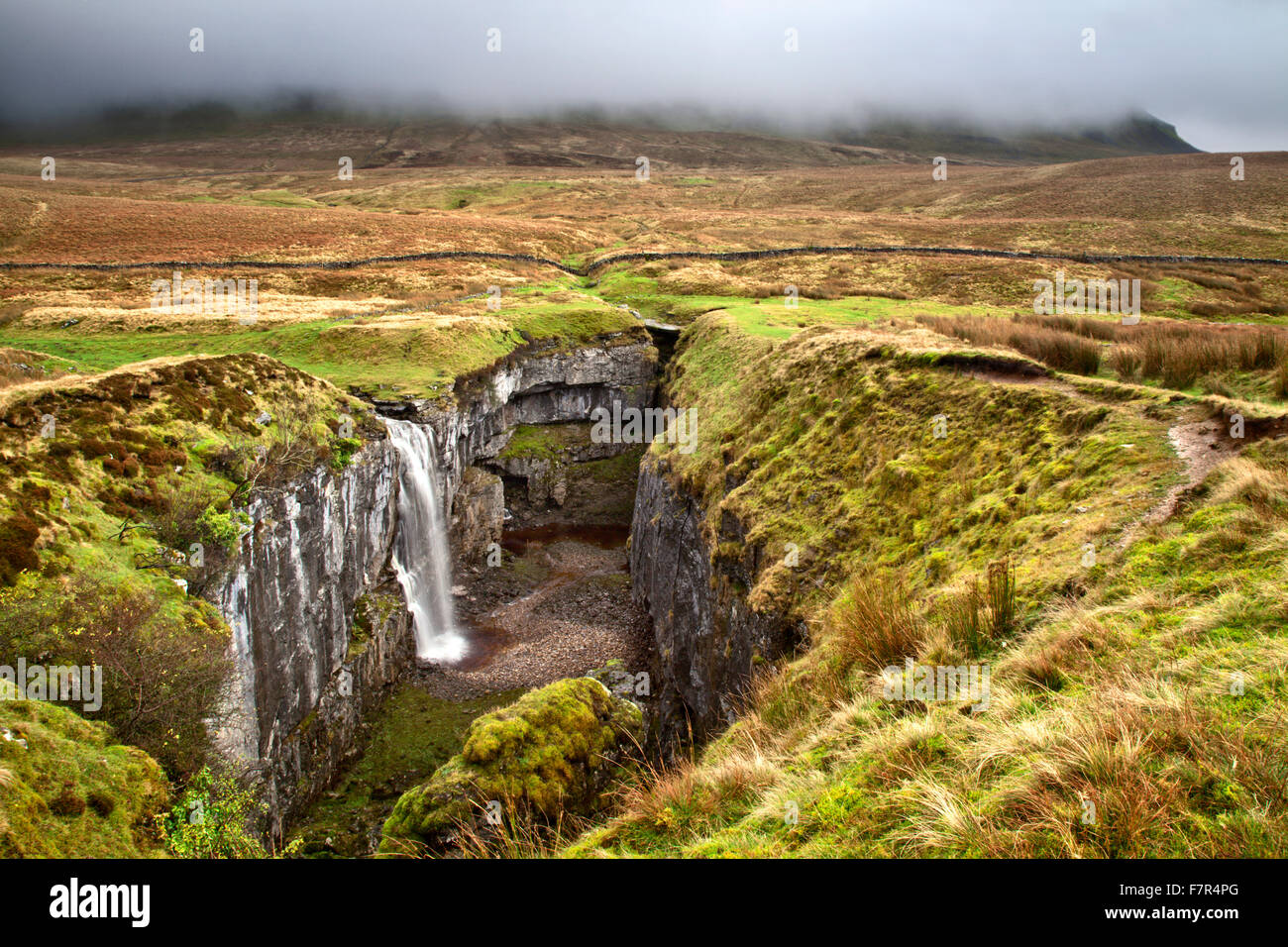 Waterfall at Hull Pot with Pen Y Ghent Shrouded in Low Cloud Horton in ...