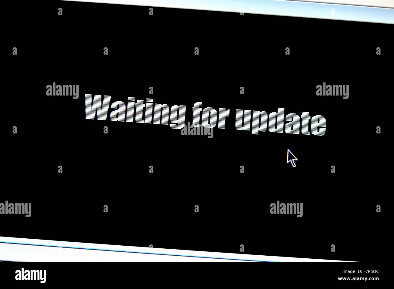 waiting for update sign on lcd display Stock Photo - Alamy