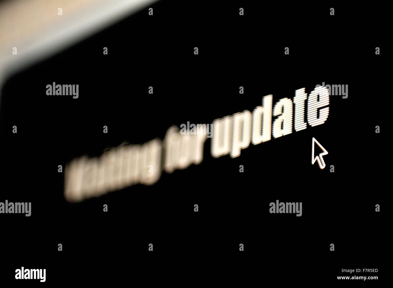 waiting for update sign on lcd display Stock Photo - Alamy