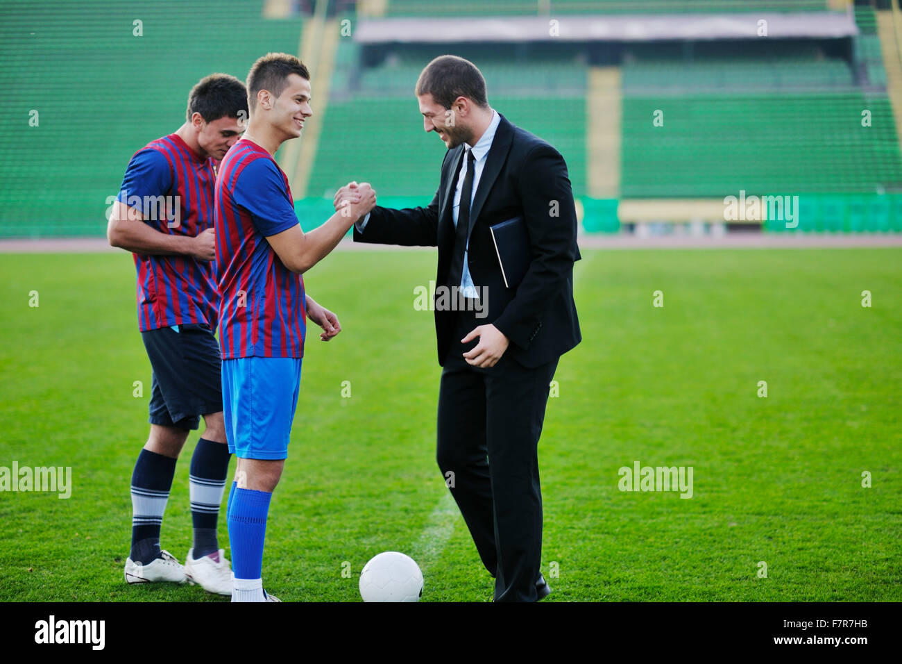soccer sport manager in business suit coach and football player on ...