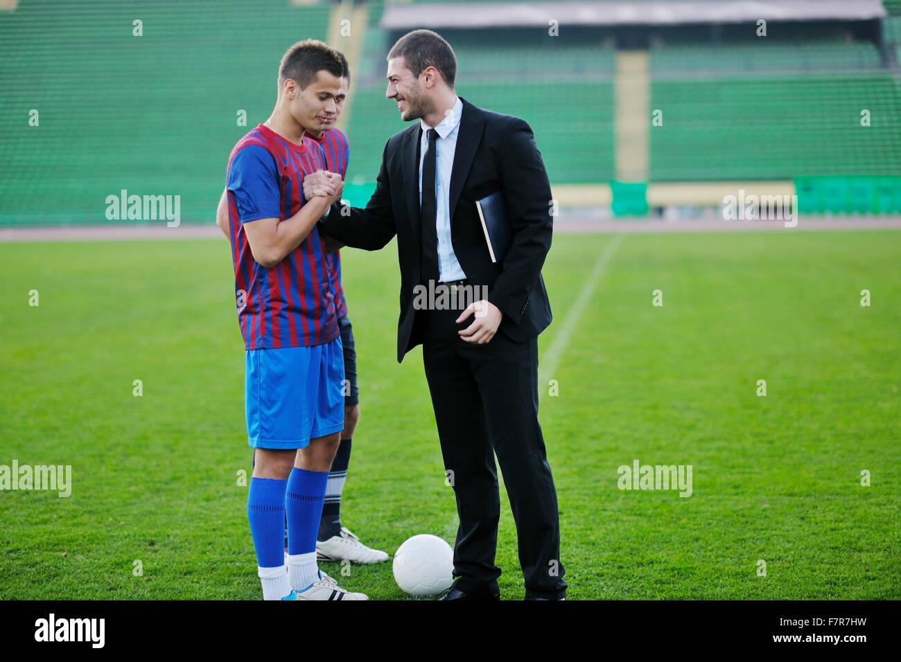 soccer sport manager in business suit coach and football player on ...