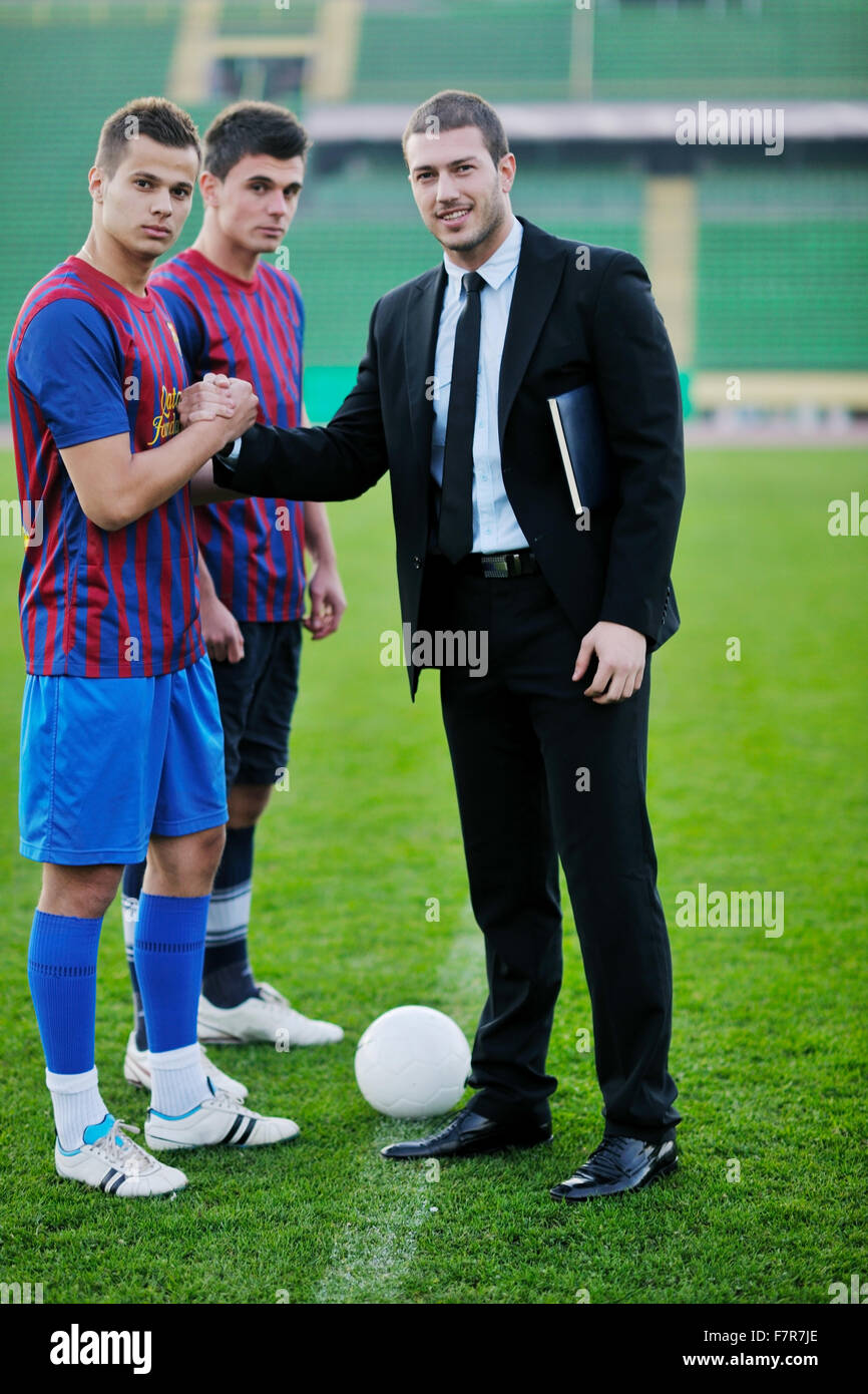 soccer sport manager in business suit coach and football player on ...