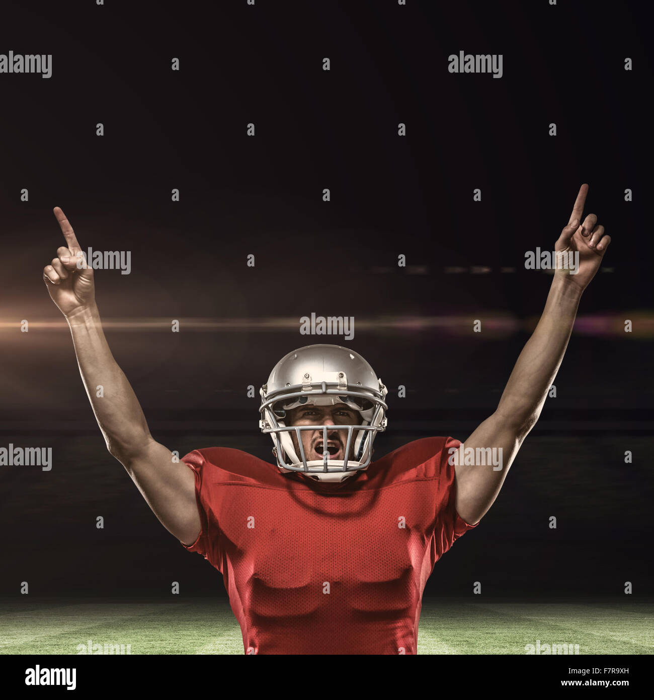 Composite image of american football player with arms raised standing ...