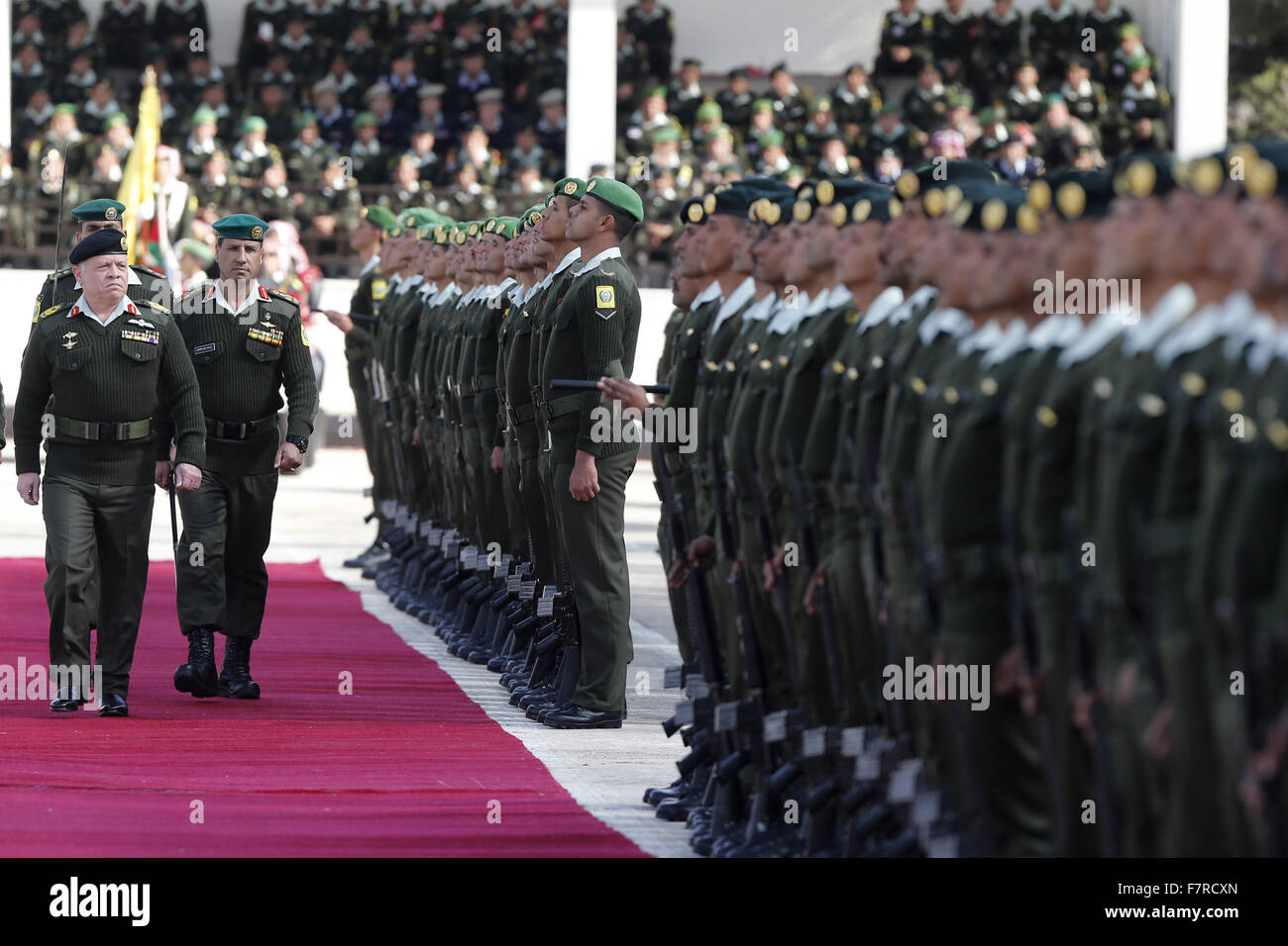 Amman. 2nd Dec, 2015. Jordanian King Abdullah II (L) reviews the honor ...